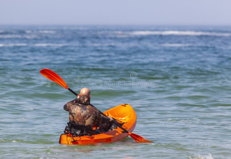 Man in the ocean on kayak editorial stock image. Image of summer ...