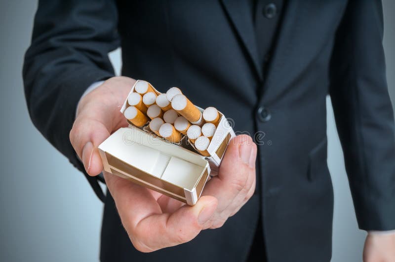 Man is Offering Cigarette from Cigarette Pack Stock Image - Image of hand, holding: 74753071