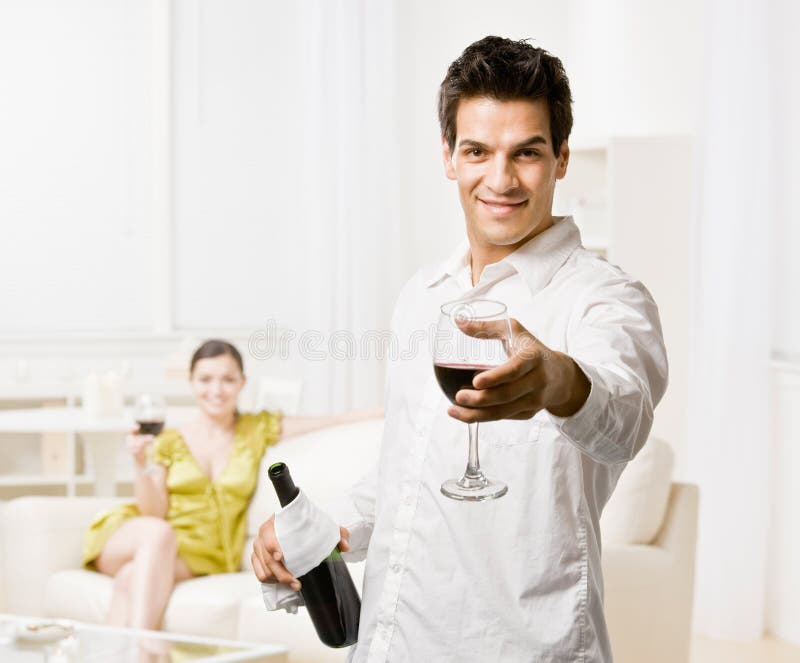 Man Offering Glass of Red Wine Stock Image - Image of hispanic, food ...