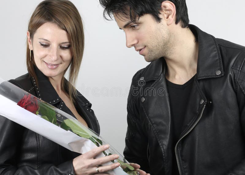 Man Offering a Rose To a Woman Stock Image - Image of offering, happy ...