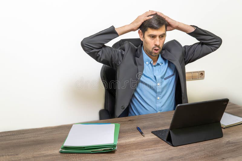Man in the Office with His Arms Above His Head with a Surprised ...