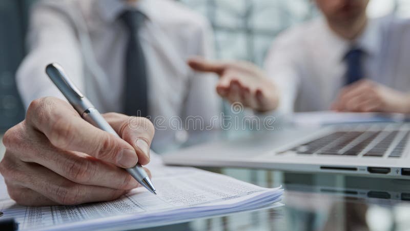 Man in the Office Makes a Note in a Notebook Stock Image - Image of ...
