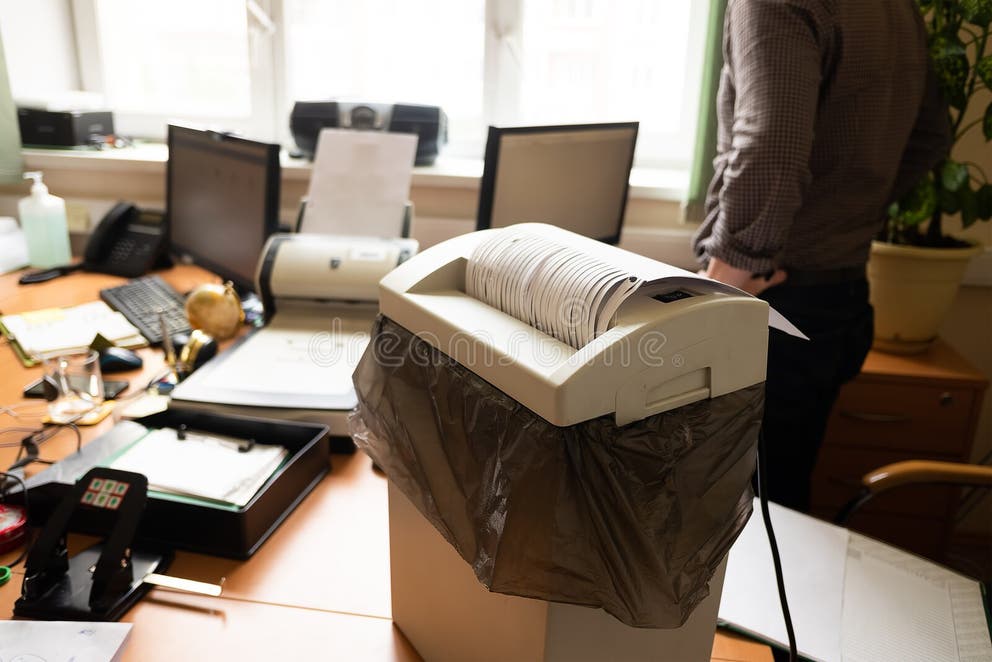 Man in Office Shreds Paper Documents in a Shredder Stock Image - Image ...