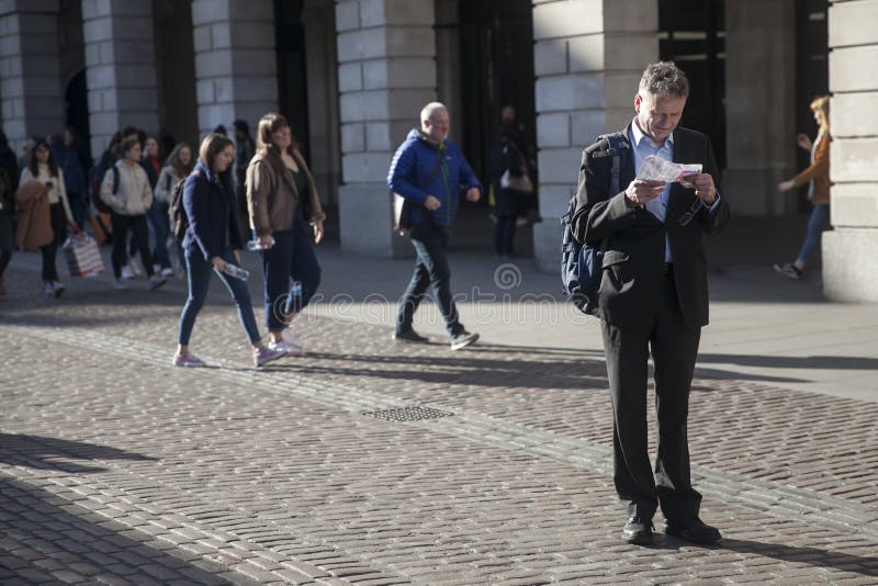 A Man in an Office Suit is Considering a Subway Map Editorial Photo ...