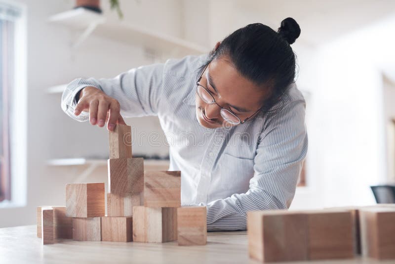 Man in Office with Wood Block Game, Thinking Challenge and Design ...