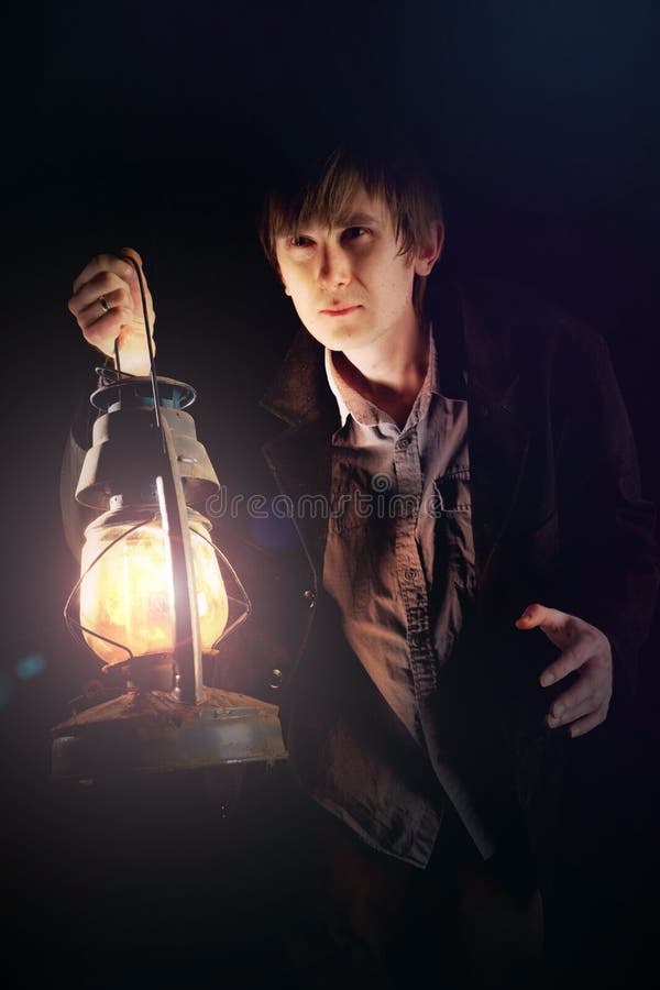 Man with oil lamp stock photo. Image of search, look - 22969722