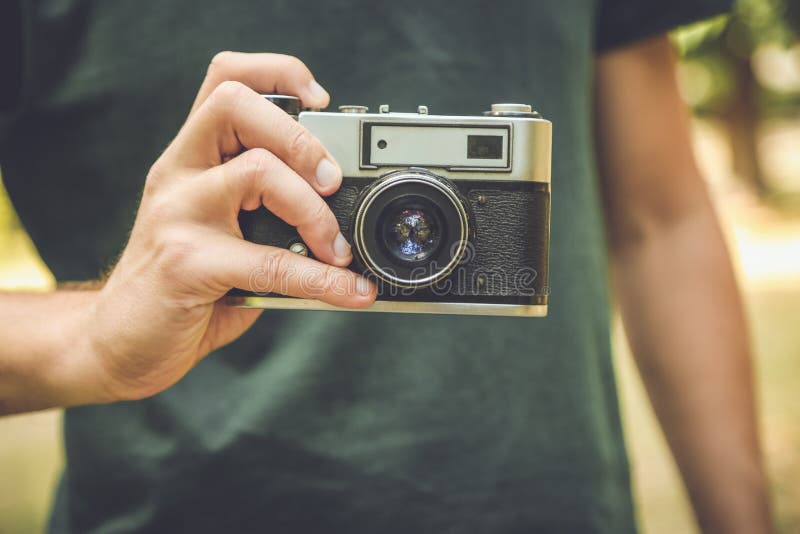 Man with Old Camera in a Hand. Stock Photo - Image of holding ...