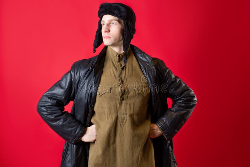 A Man in Old-fashioned Clothes and a Hat with Earflaps, Russian Post ...