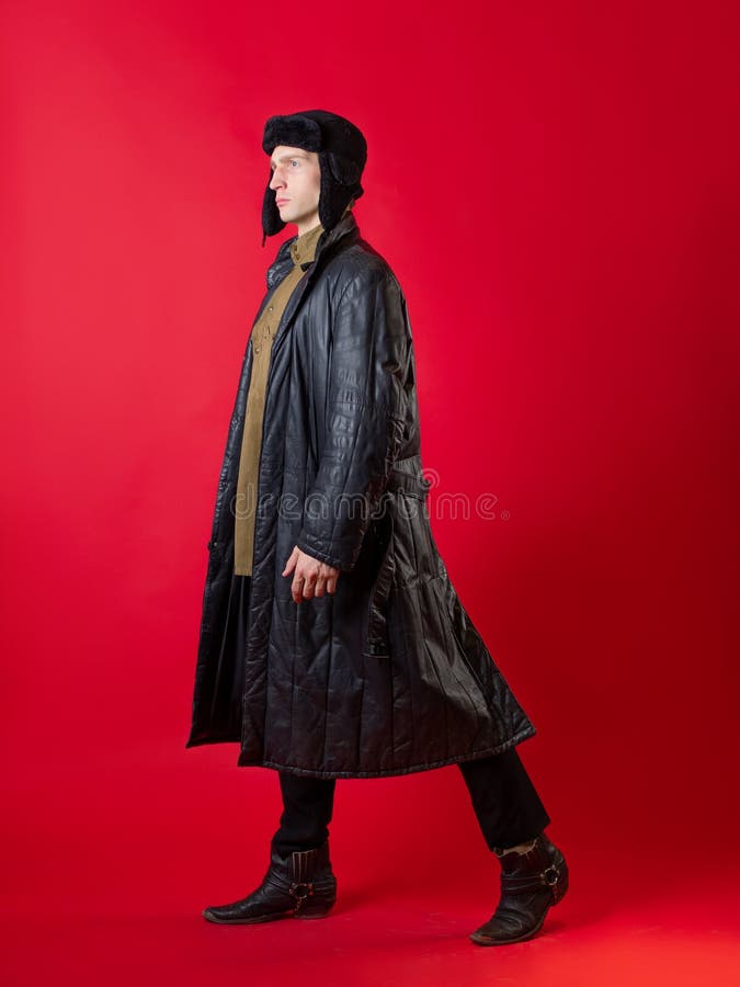 A Man in Old-fashioned Clothes and a Hat with Earflaps, Russian Post ...