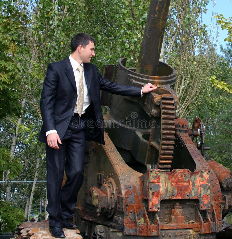 Man and old gun stock image. Image of clothing, metal - 8353431