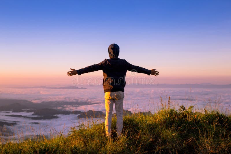 Man Open Arms on Top of Mountain with Flowing Mist and Beautiful Stock ...
