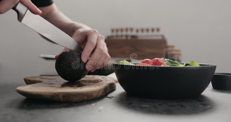 Man Open Avocado on Kitchen Countertop Stock Photo - Image of ...