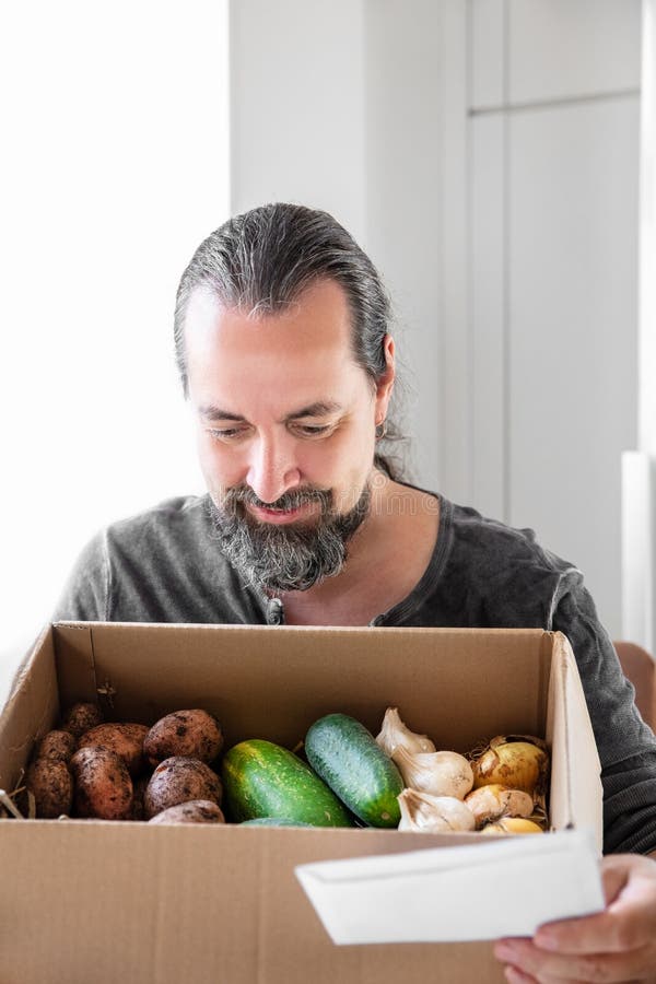 Man Opened a Package with Organic Vegetables Stock Image - Image of ...