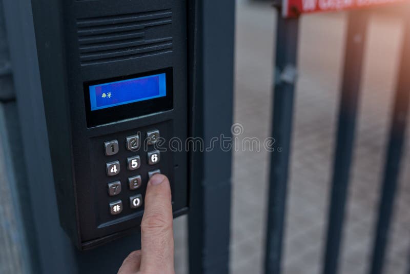 Man Opening Automatic Property Gate with Security Code Stock Image ...
