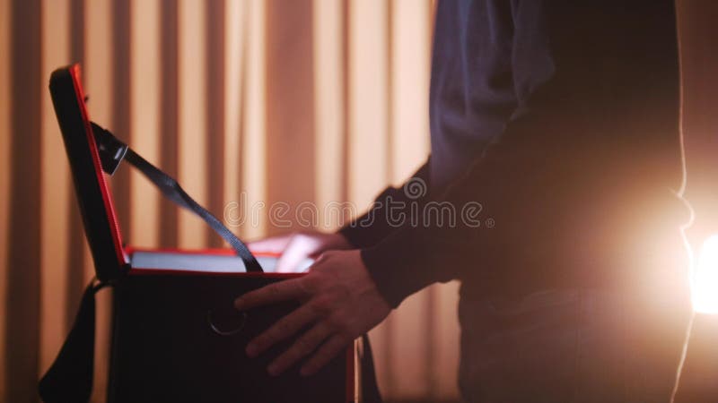 A Man Opening a Black Case. Bright Light Stock Image - Image of money ...