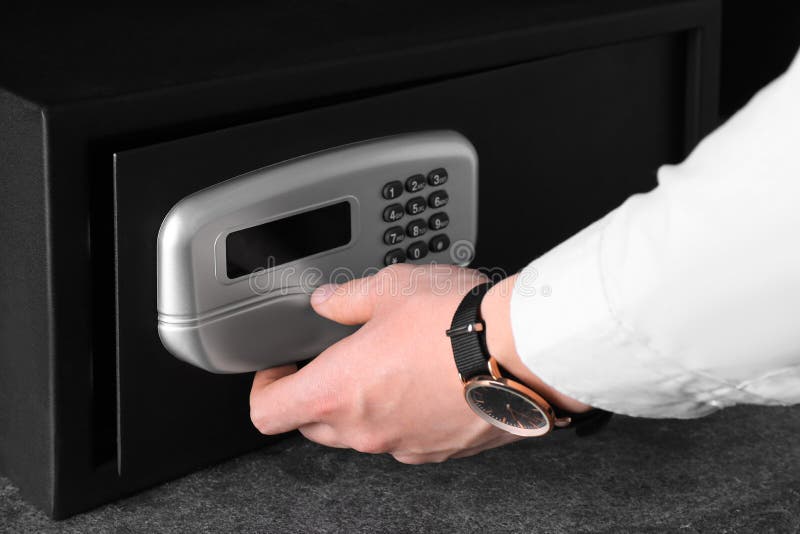 Man Opening Black Steel Safe with Electronic Lock, Closeup Stock Photo ...