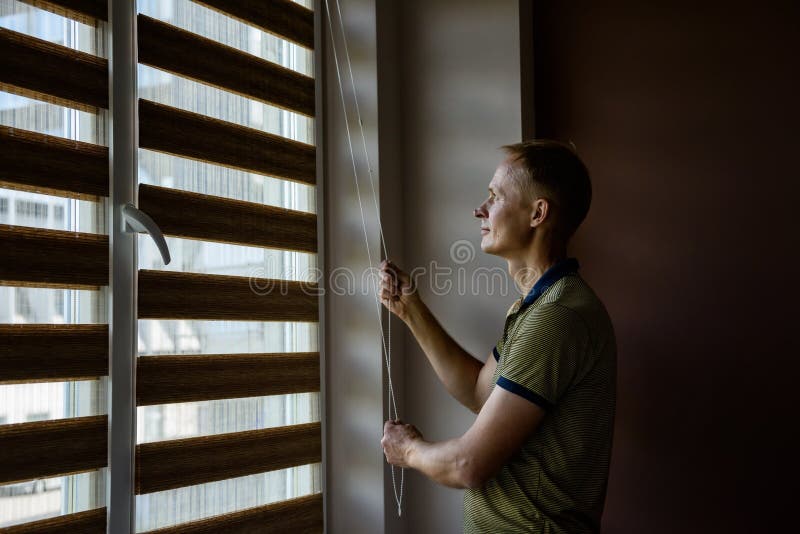 The Man is Opening the Blinds Stock Image - Image of night, home: 158605265