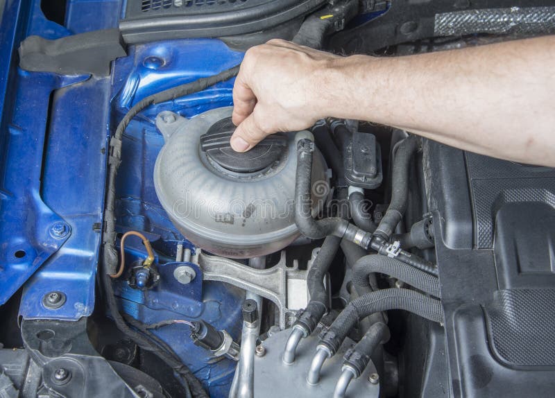 Man is Opening Car Radiator Fluid Tank To Check the Level. Stock Photo ...