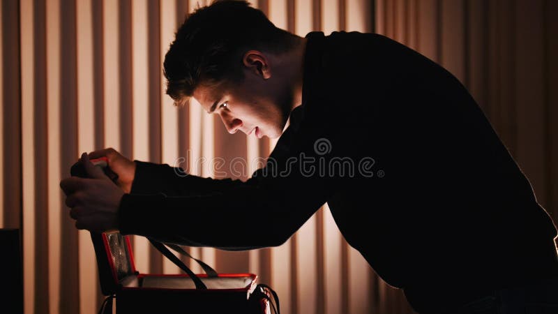 A Man Opening Case and Looking Inside Stock Image - Image of holding ...