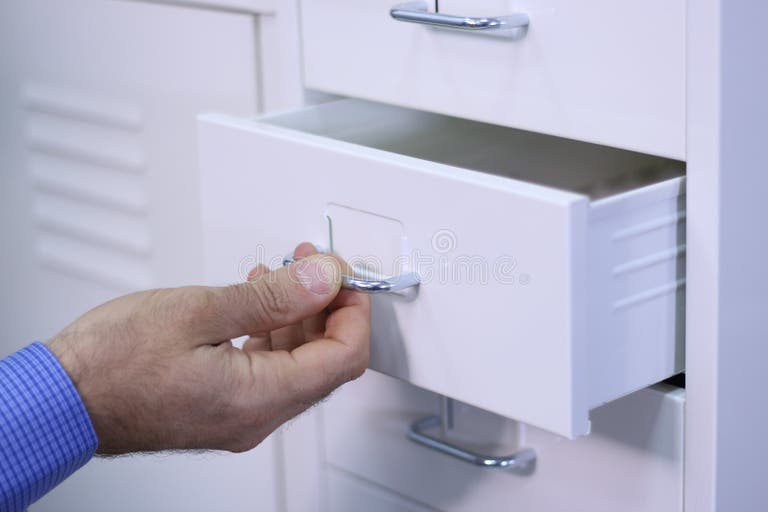 Man Opening a Drawer in a Cabinet Stock Image - Image of files, archive ...