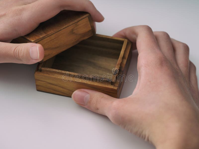 A Man Opening an Empty Small Wooden Box with His Hands Stock Image ...