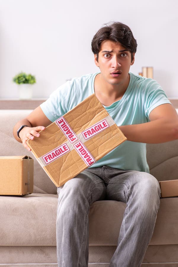 The Man Opening Fragile Parcel Ordered from Internet Stock Image ...