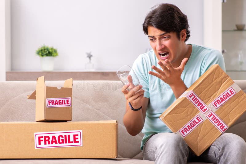 The Man Opening Fragile Parcel Ordered from Internet Stock Photo ...