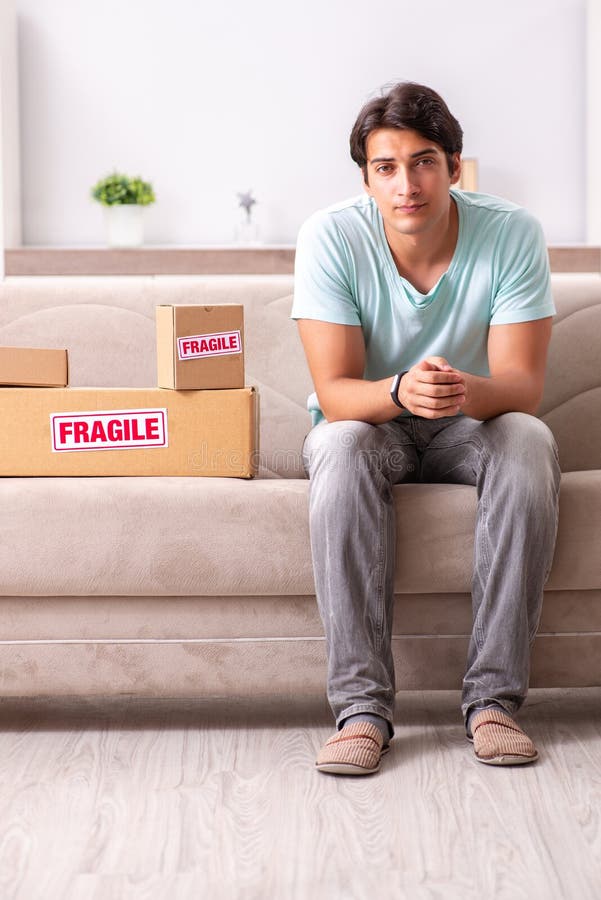 The Man Opening Fragile Parcel Ordered from Internet Stock Photo ...