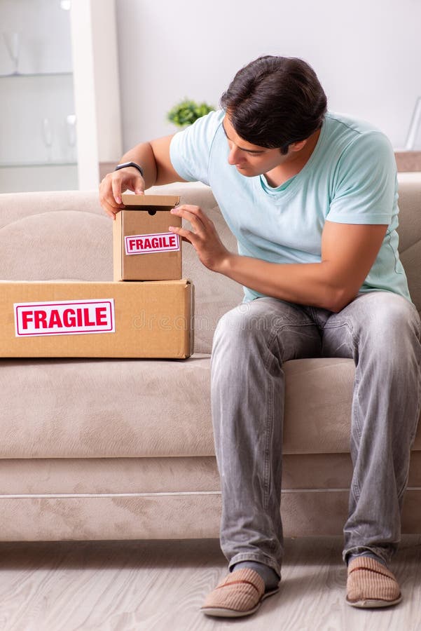 The Man Opening Fragile Parcel Ordered from Internet Stock Image ...