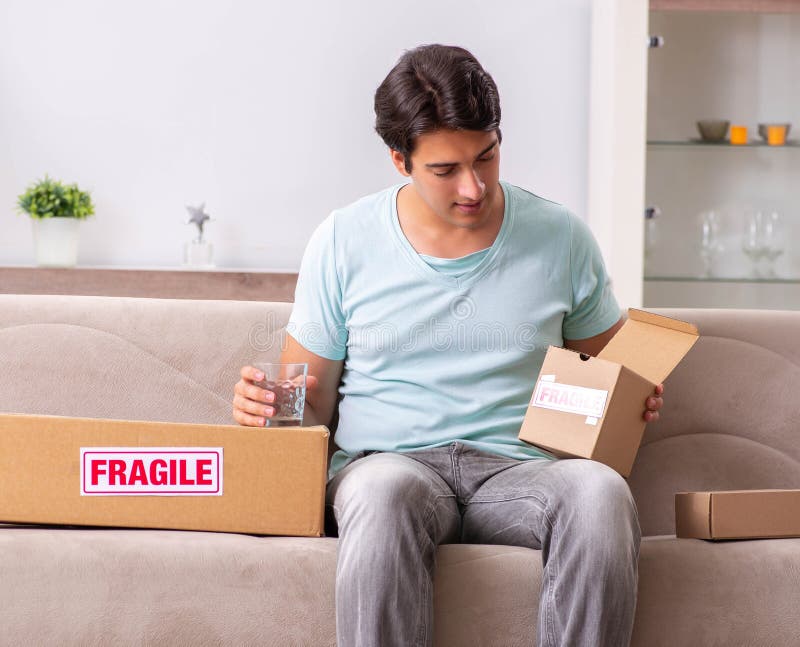 Man Opening Fragile Parcel Ordered from Internet Stock Image - Image of ...