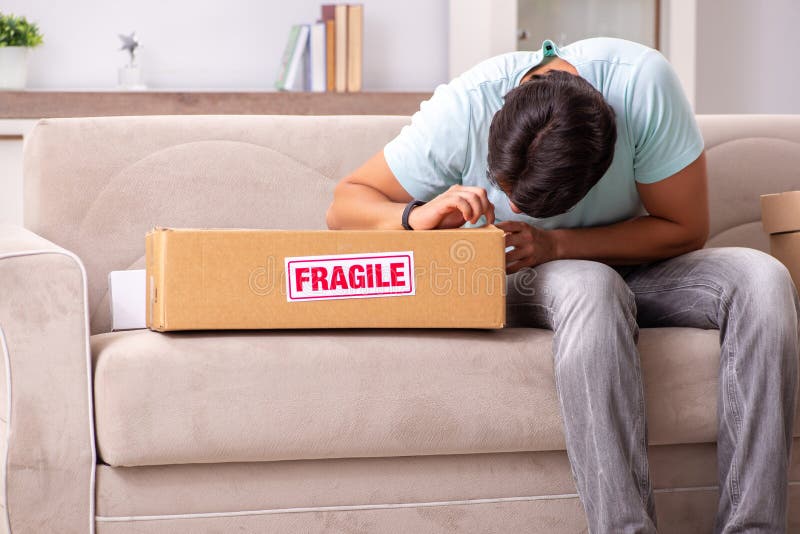 The Man Opening Fragile Parcel Ordered from Internet Stock Photo ...