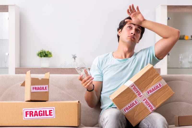 The Man Opening Fragile Parcel Ordered from Internet Stock Photo ...