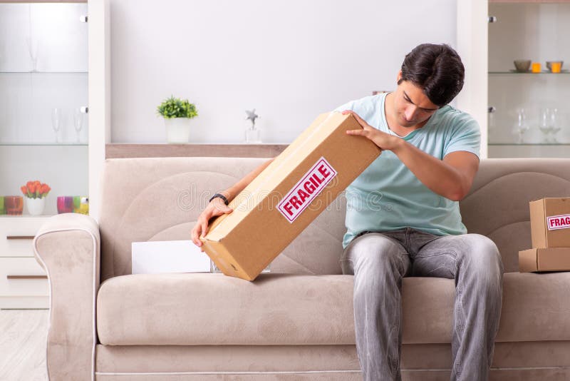 The Man Opening Fragile Parcel Ordered from Internet Stock Image ...