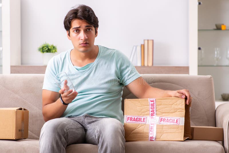 The Man Opening Fragile Parcel Ordered from Internet Stock Photo ...