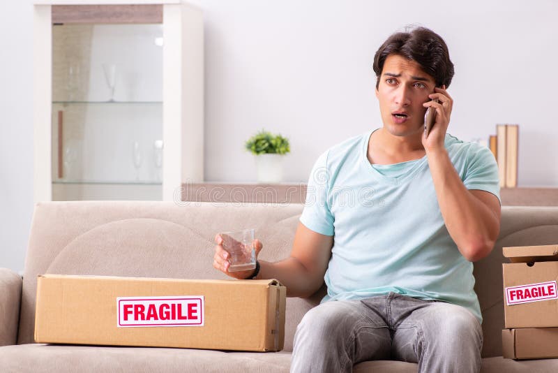 The Man Opening Fragile Parcel Ordered from Internet Stock Photo ...