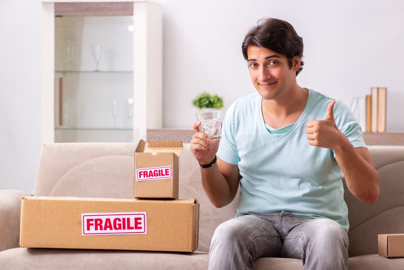 The Man Opening Fragile Parcel Ordered from Internet Stock Photo ...