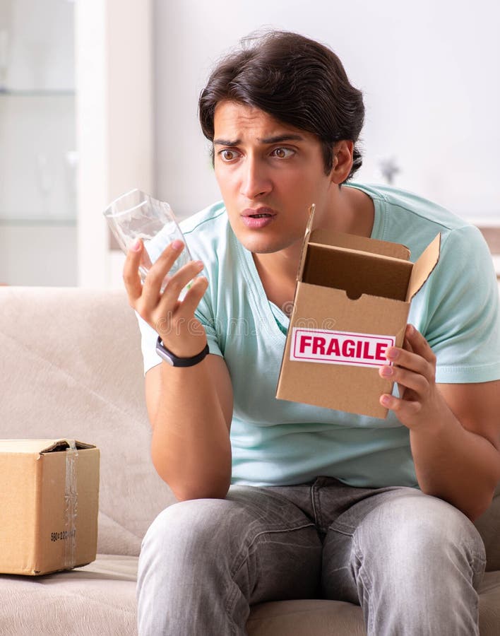 Man Opening Fragile Parcel Ordered from Internet Stock Photo - Image of ...