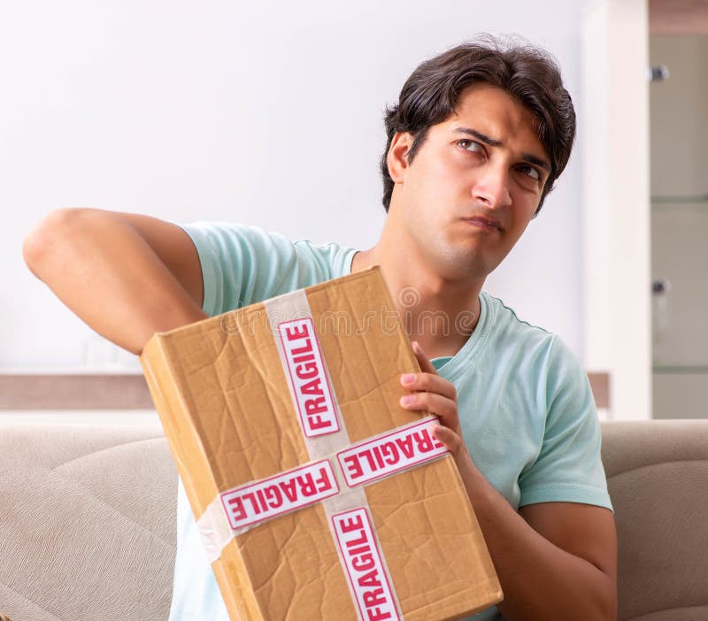 Man Opening Fragile Parcel Ordered from Internet Stock Image - Image of ...
