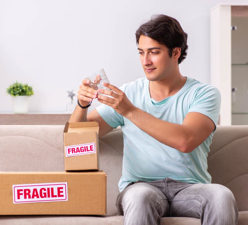 Man Opening Fragile Parcel Ordered from Internet Stock Image - Image of ...