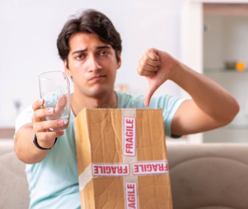 Man Opening Fragile Parcel Ordered from Internet Stock Photo - Image of ...