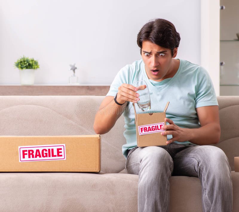 Man Opening Fragile Parcel Ordered from Internet Stock Photo - Image of ...