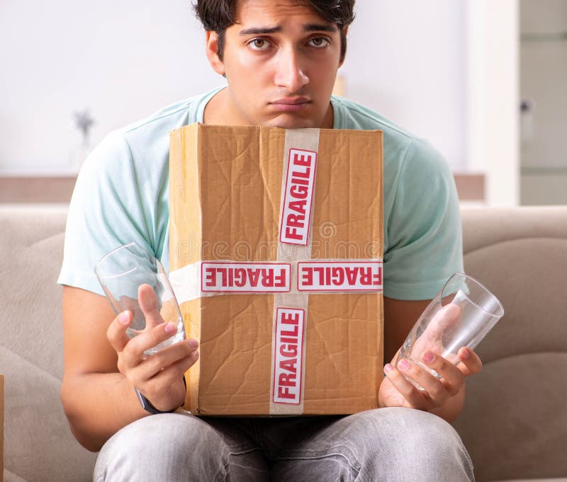 Man Opening Fragile Parcel Ordered from Internet Stock Image - Image of ...
