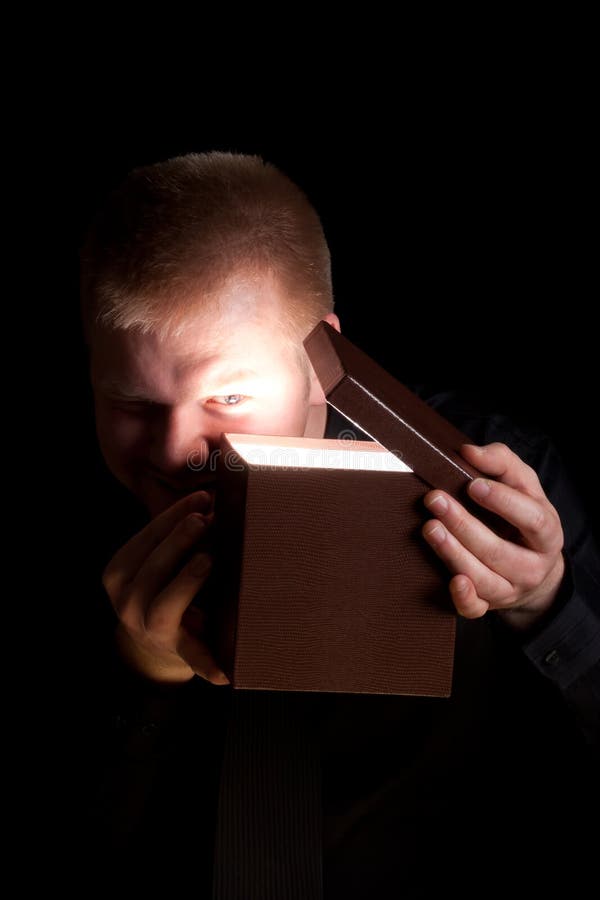 Man Opening a Gift Box stock photo. Image of face, expression - 24798068
