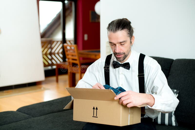 Man opening a package stock image. Image of charming - 68877777