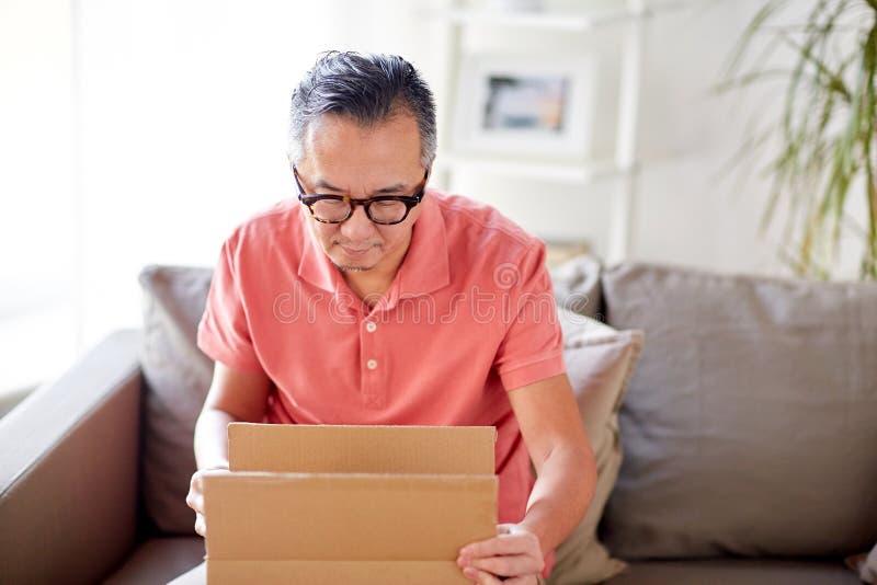 Man Opening Parcel Box at Home Stock Image - Image of opening, asian ...