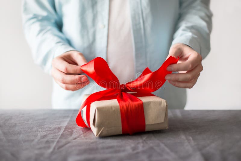 Opening a Carton Box. Hands Holding Gift Box in Cardboard Box Stock ...