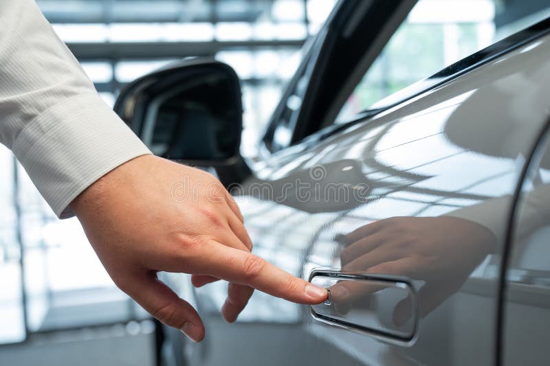 A Man Opens a Car Door with a Fingerprint. Integrated Handle. Stock ... A Man Opens a Car Door with a Fingerprint. Integrated Handle. Stock ...
