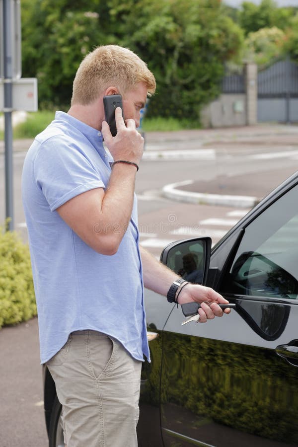 Man Opens Car Door while Talking on Phone Stock Photo - Image of door ...