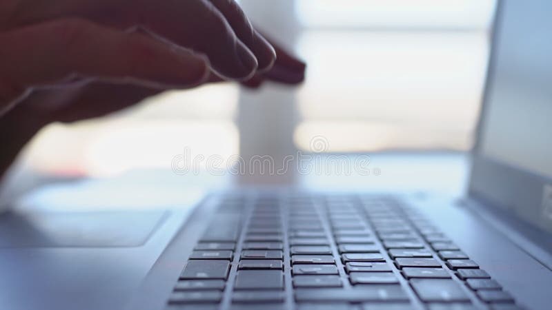 The Man Opens the Computer, Laptop on the Desktop, Opposite the Window ...