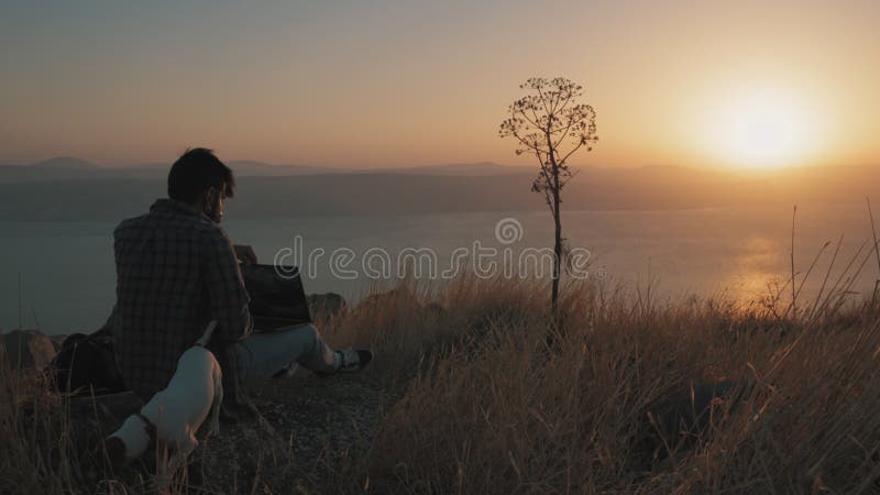 A Man Opens a Computer at Sunset Stock Video - Video of work, indian ...
